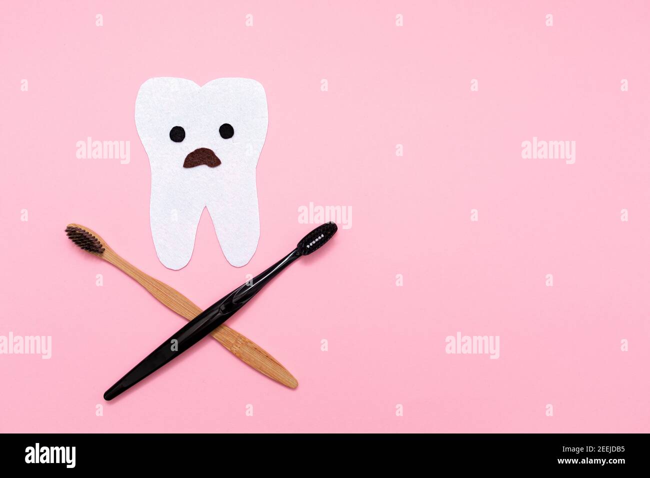 Care for the oral cavity. A startled tooth, cut out of felt with ...