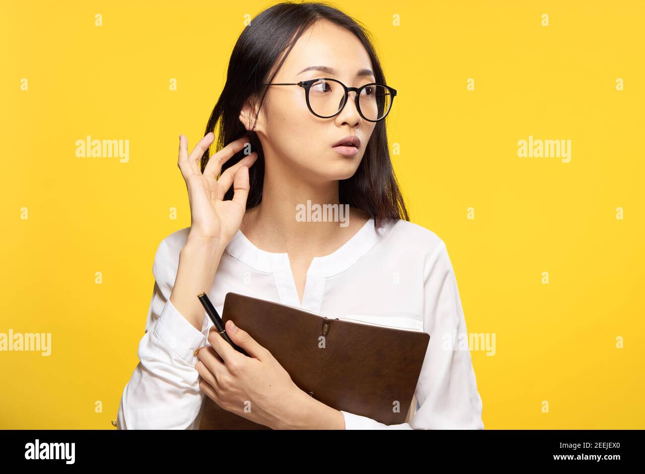 elegant woman with notepad in hands official office yellow isolated ...