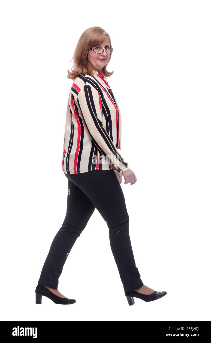 in full growth. smiling modern woman striding forward Stock Photo - Alamy