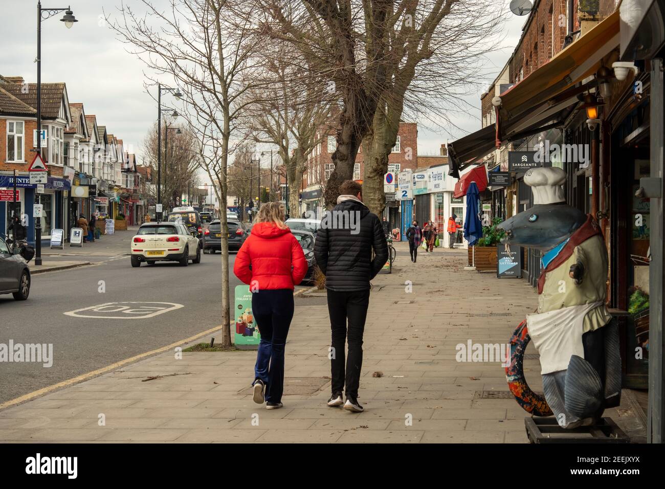 London- Northfields high street, a long street of shops on residential ...