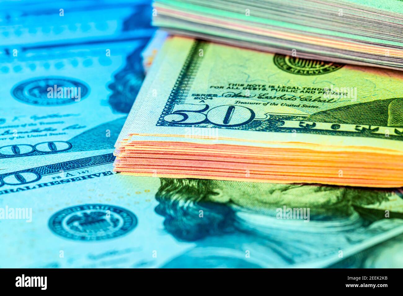 money background from dollars in neon light, close up Stock Photo - Alamy
