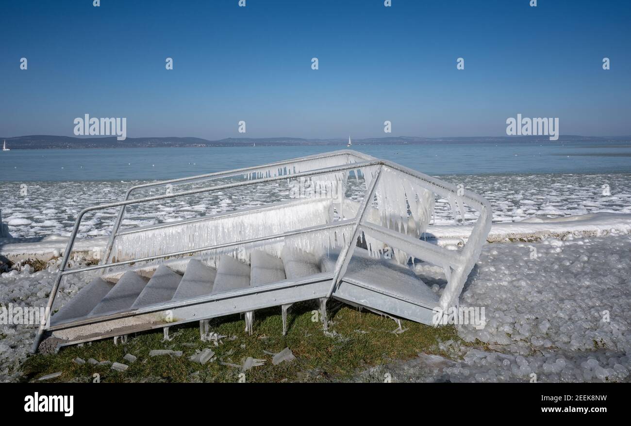Beautiful frozen Lake Balaton with steel steps Stock Photo - Alamy