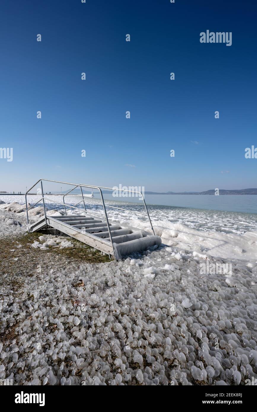 Beautiful frozen Lake Balaton with steel steps Stock Photo - Alamy