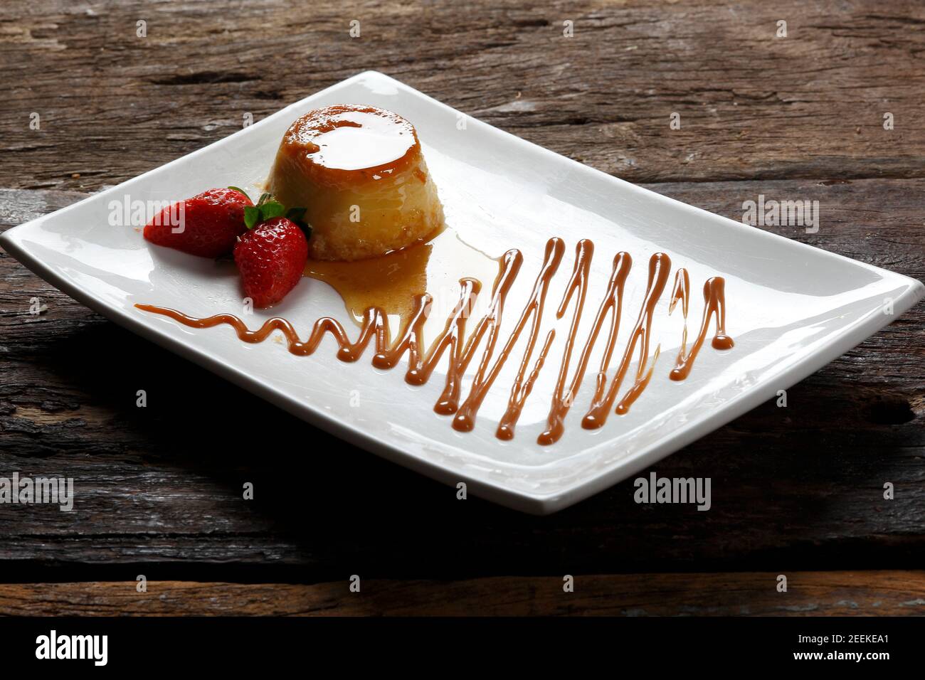 Pudding with milk and eggs with syrup Stock Photo - Alamy