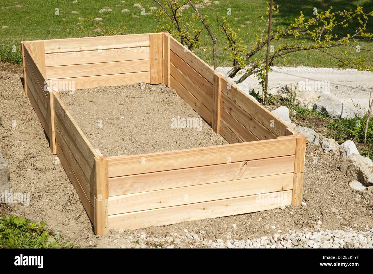 New wooden frame for a raised garden bed. DIY concept. Sustainable ...