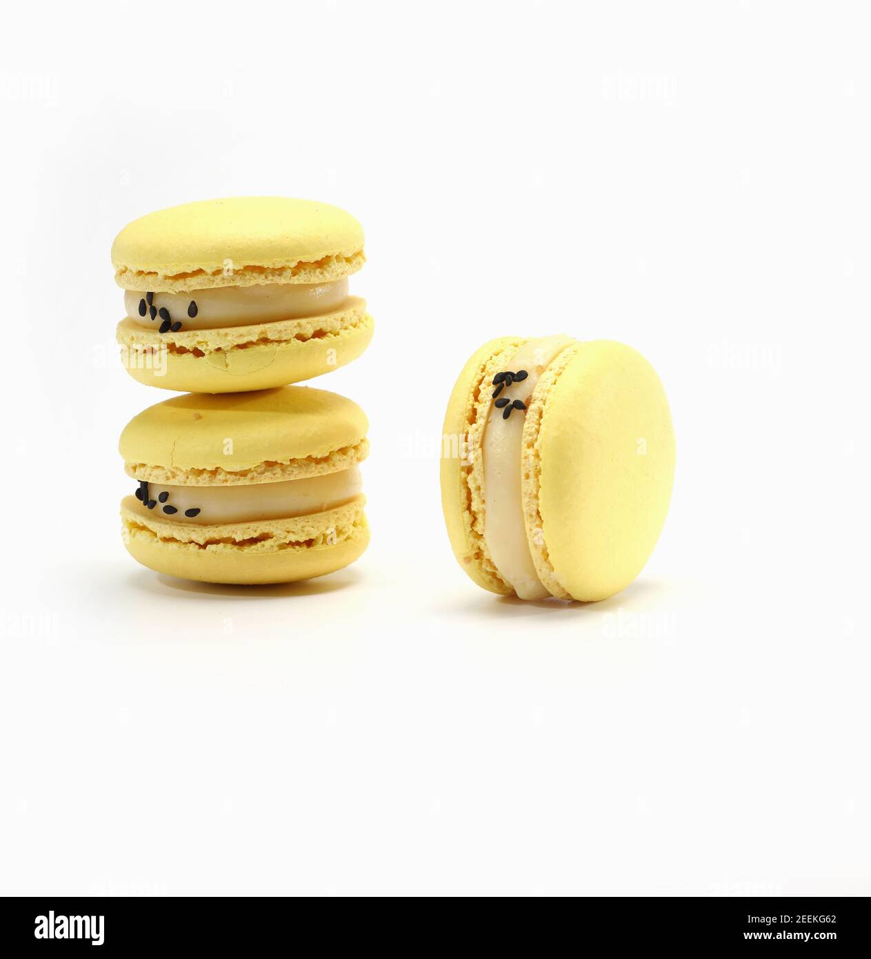 three cake of macaron or macaroon yellow lemon color. Delicious ...