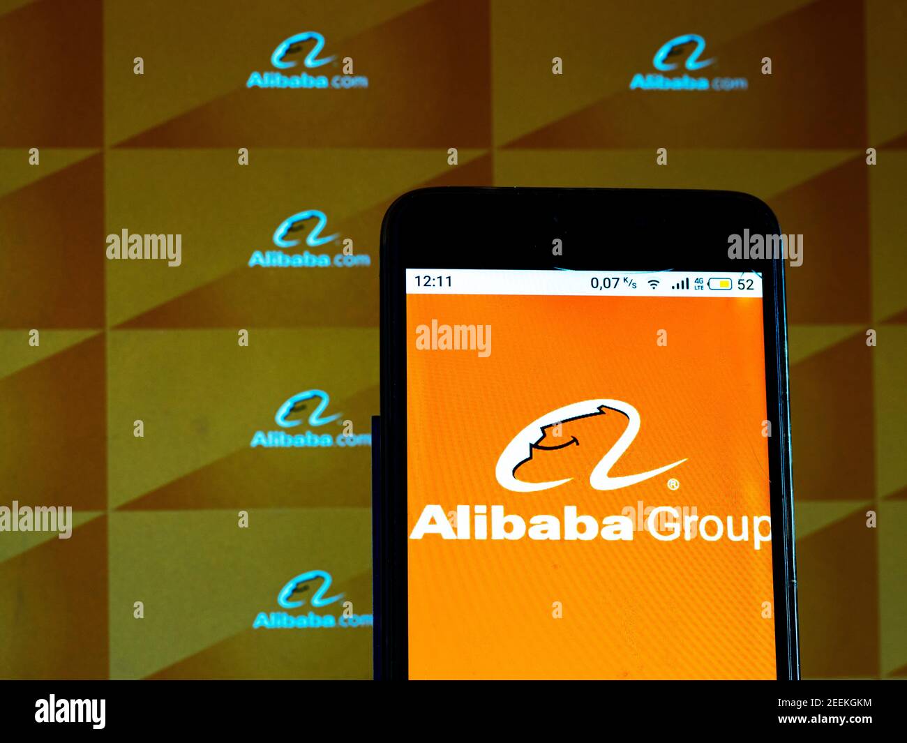 In this photo illustration, the Alibaba Group logo seen displayed on a ...