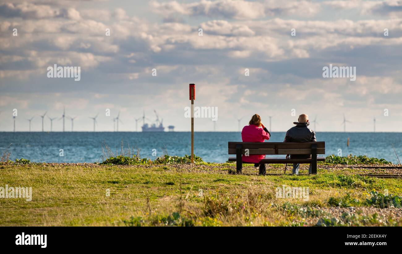 Wind turbines of offshore windfarm in distance hi-res stock photography ...
