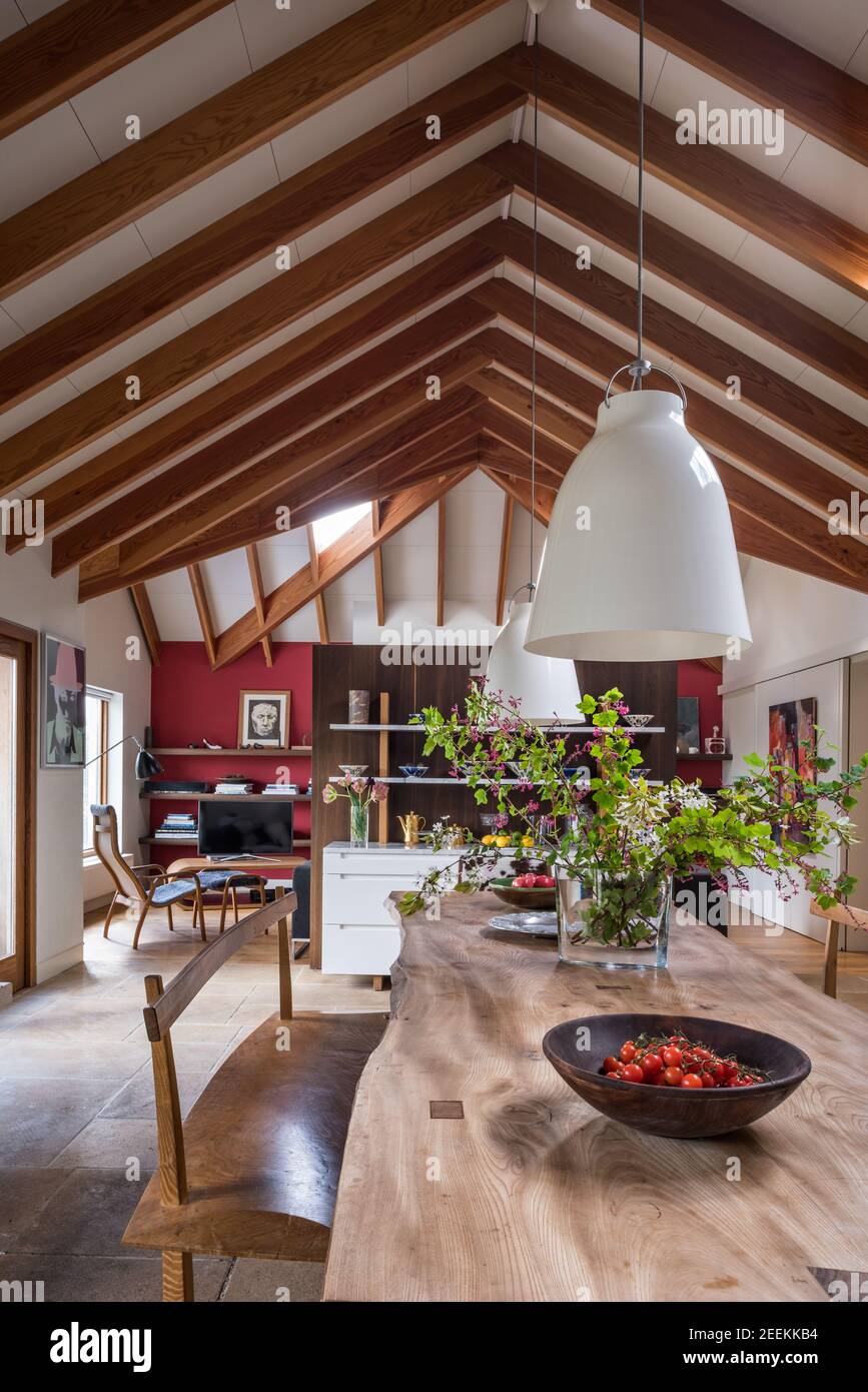 Fritz Hansen Caravaggio pendant shades above Dominic Ash table Stock ...