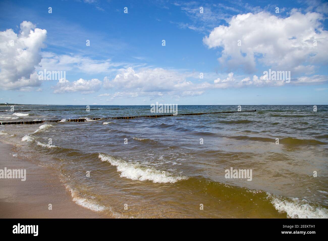 The lonely beach with waves and sun on the island of Usedom Stock Photo ...