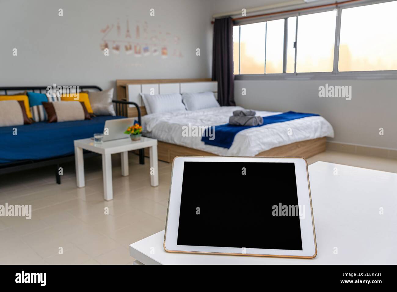 Technology tablet over the Luxury Interior living room, service ...