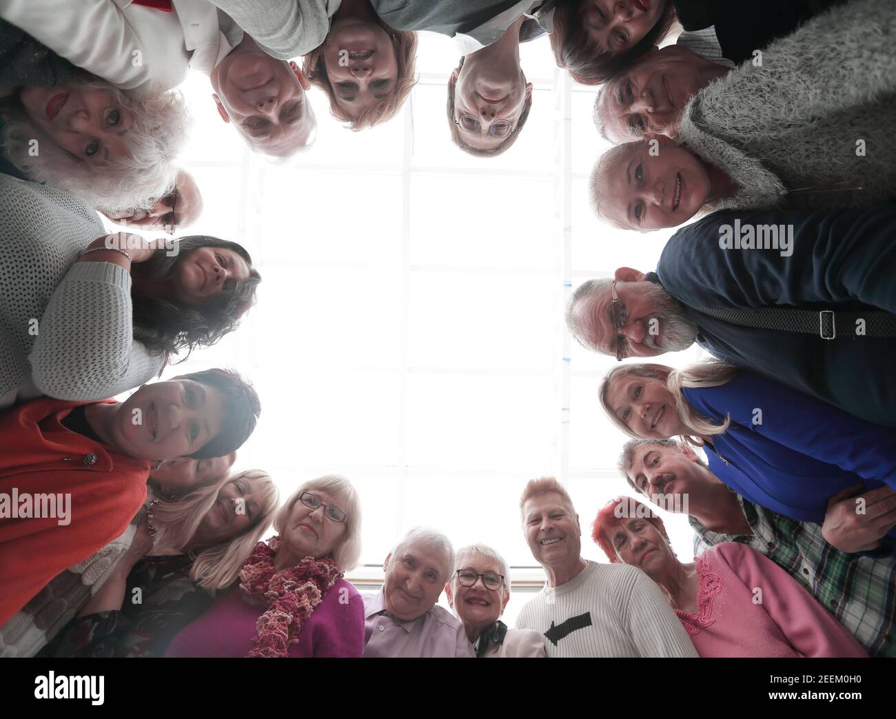 Happy people looking down at camera Stock Photo - Alamy