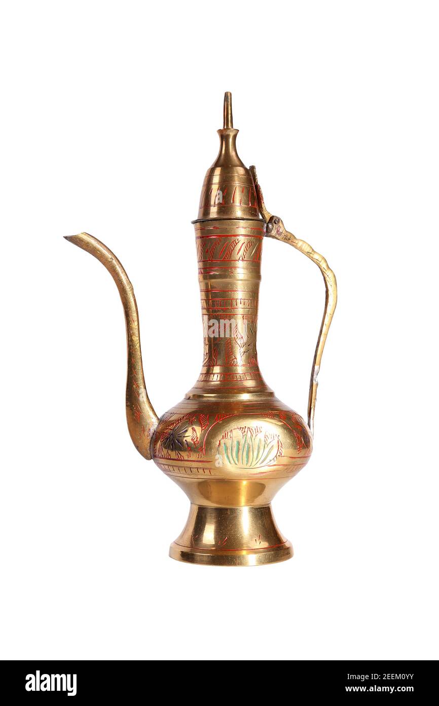 Copper jug with a traditional Arabic ornaments on a white background ...