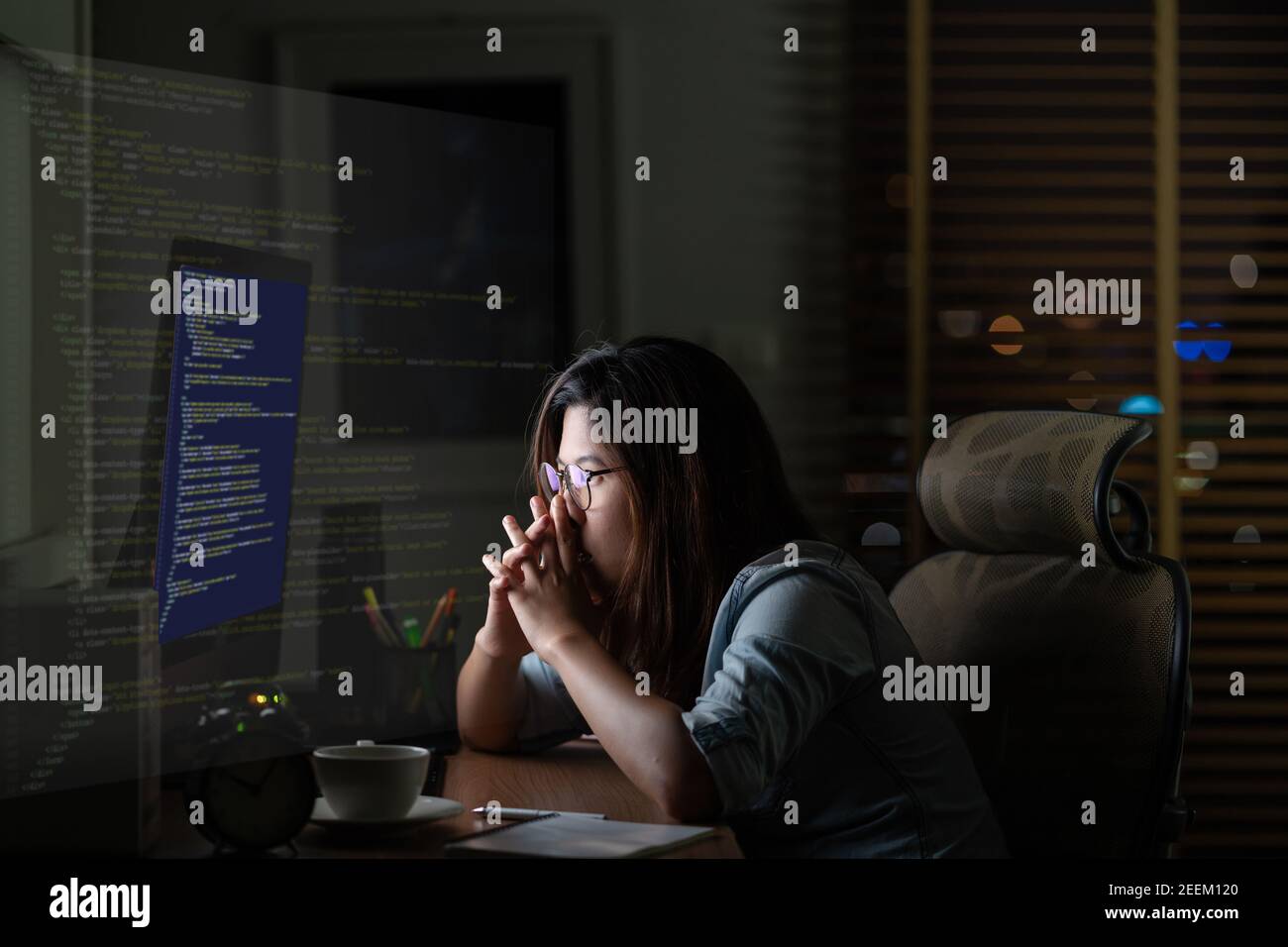 Asian Businesswoman working hard with front of computer desktop with ...