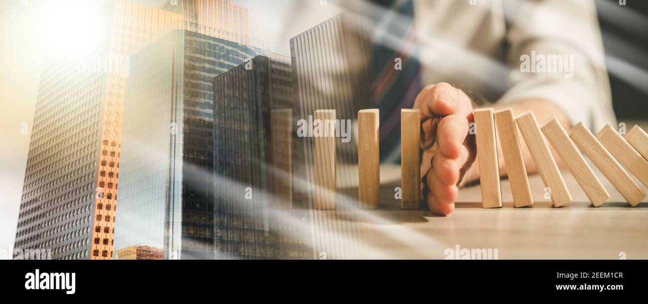 Business control concept by stopping domino effect; multiple exposure ...