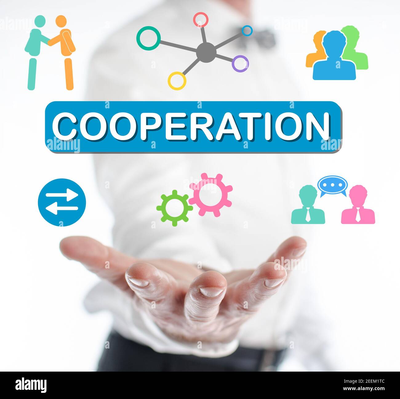 Cooperation concept levitating above a hand of a man Stock Photo - Alamy