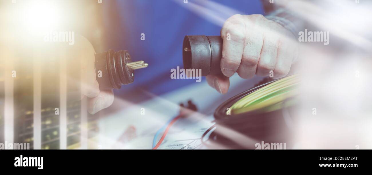 Electrician hands holding electrical plugs; multiple exposure Stock ...
