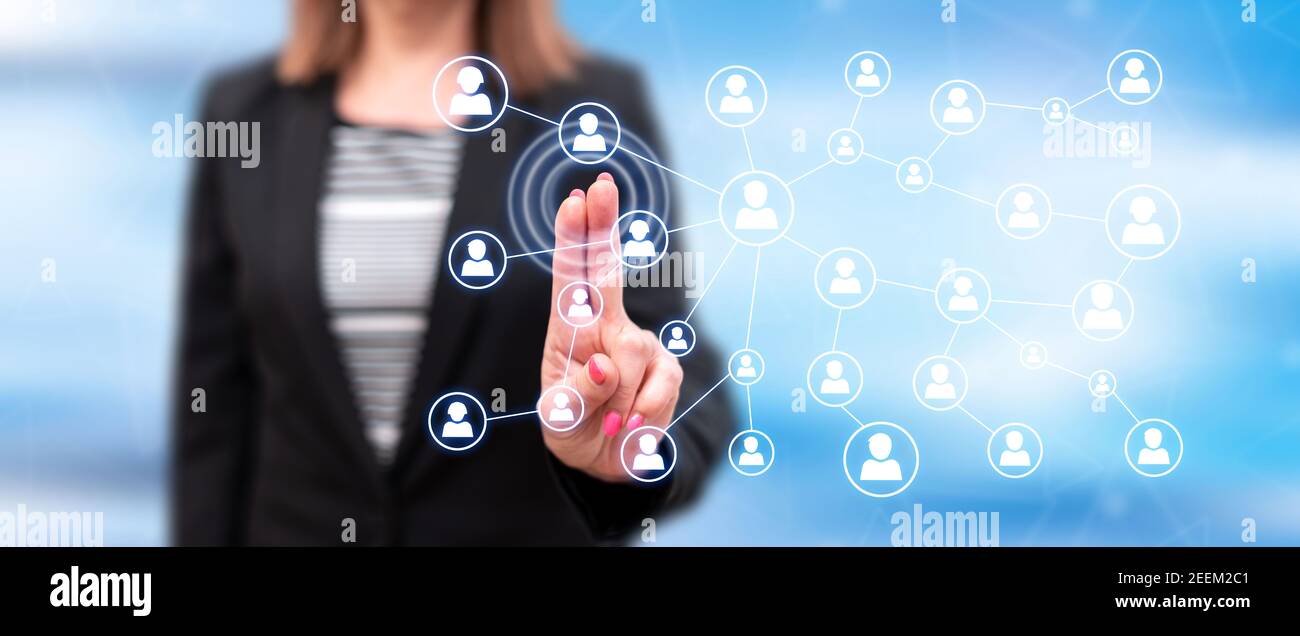 Woman touching a social media network on a touch screen with her ...
