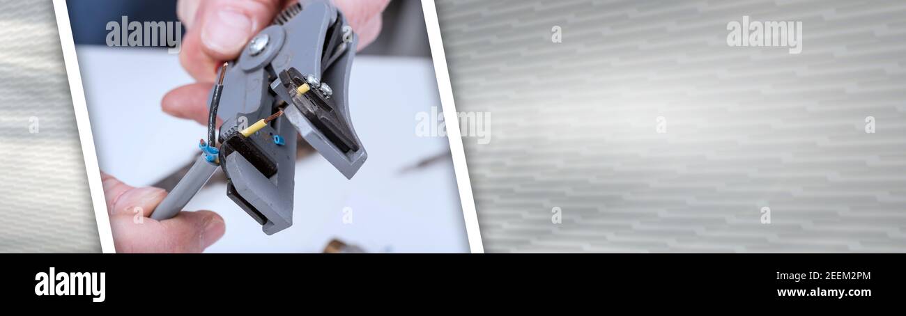 Action to strip a wire with a wire stripper, closeup. panoramic banner ...