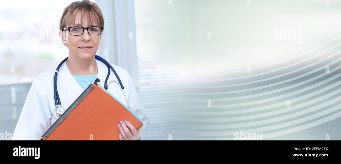 Portrait of female doctor standing and holding a folder; panoramic ...