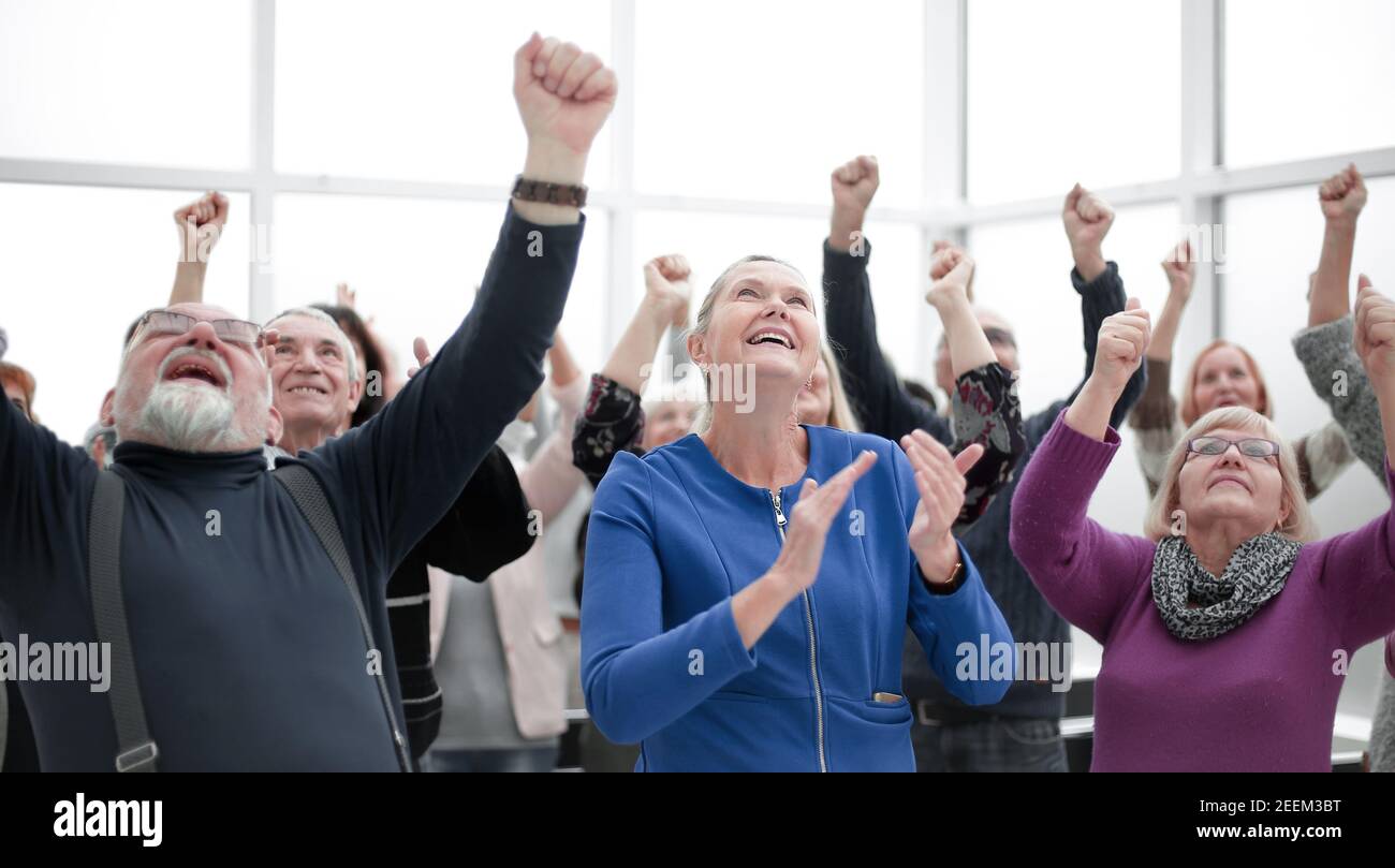 Crowd raising hands cheering hi-res stock photography and images - Alamy