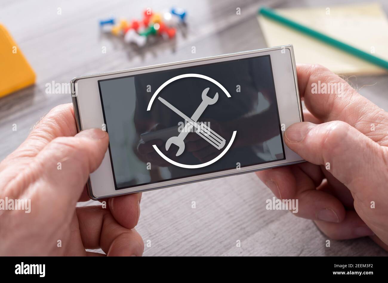 Website maintenance concept on mobile phone Stock Photo - Alamy