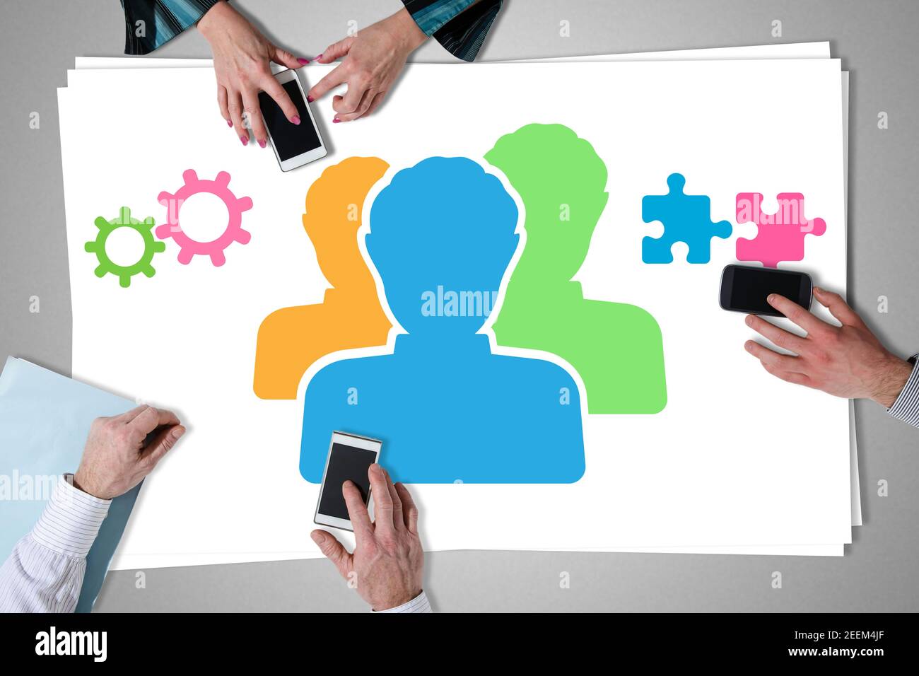 Teamwork concept placed on a desk with hands using smartphones Stock ...
