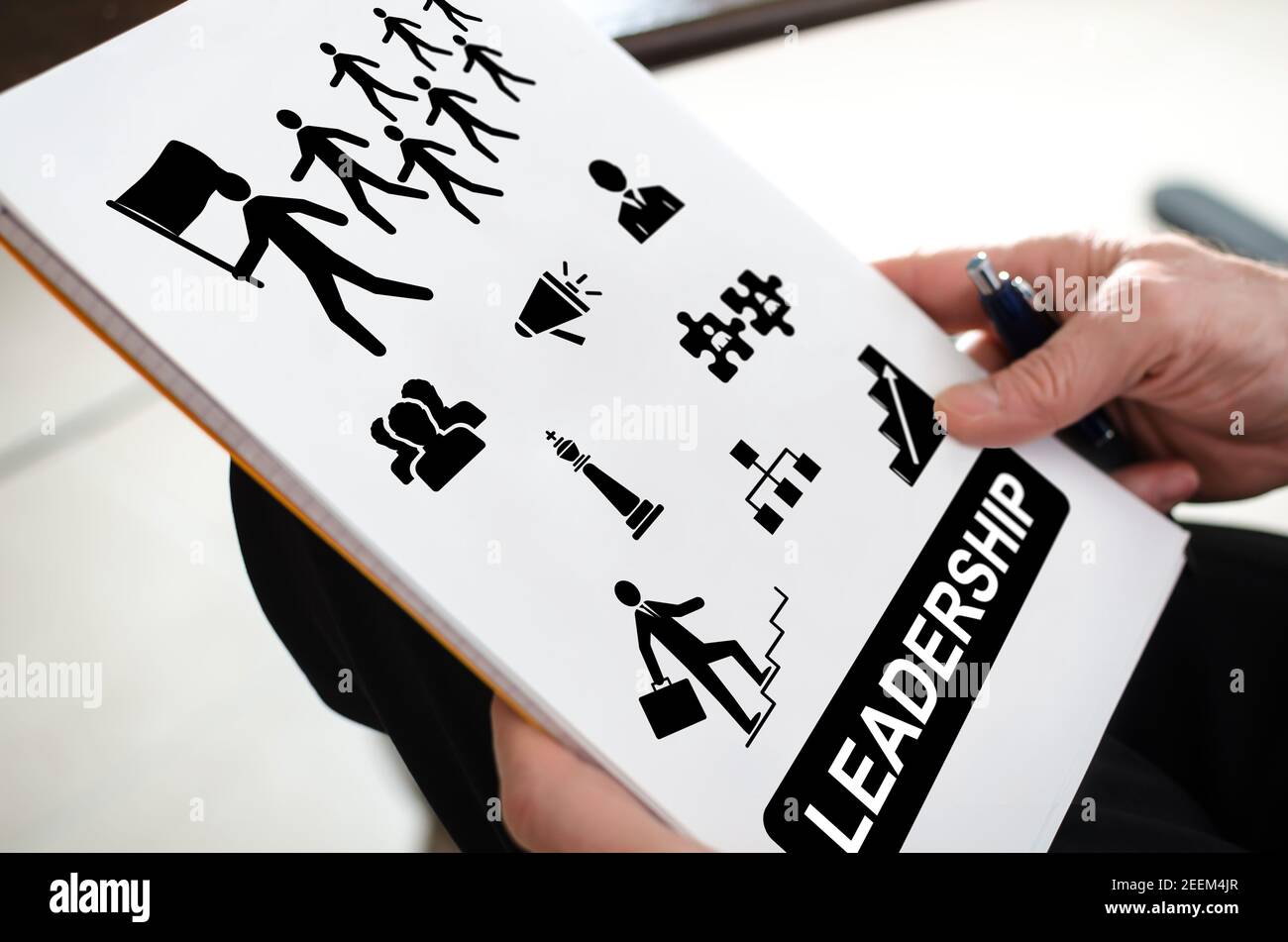 Leadership concept on a paper held by a hand Stock Photo - Alamy
