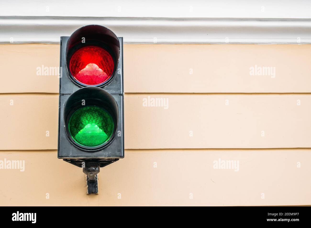 Two color traffic light on the wall Stock Photo - Alamy
