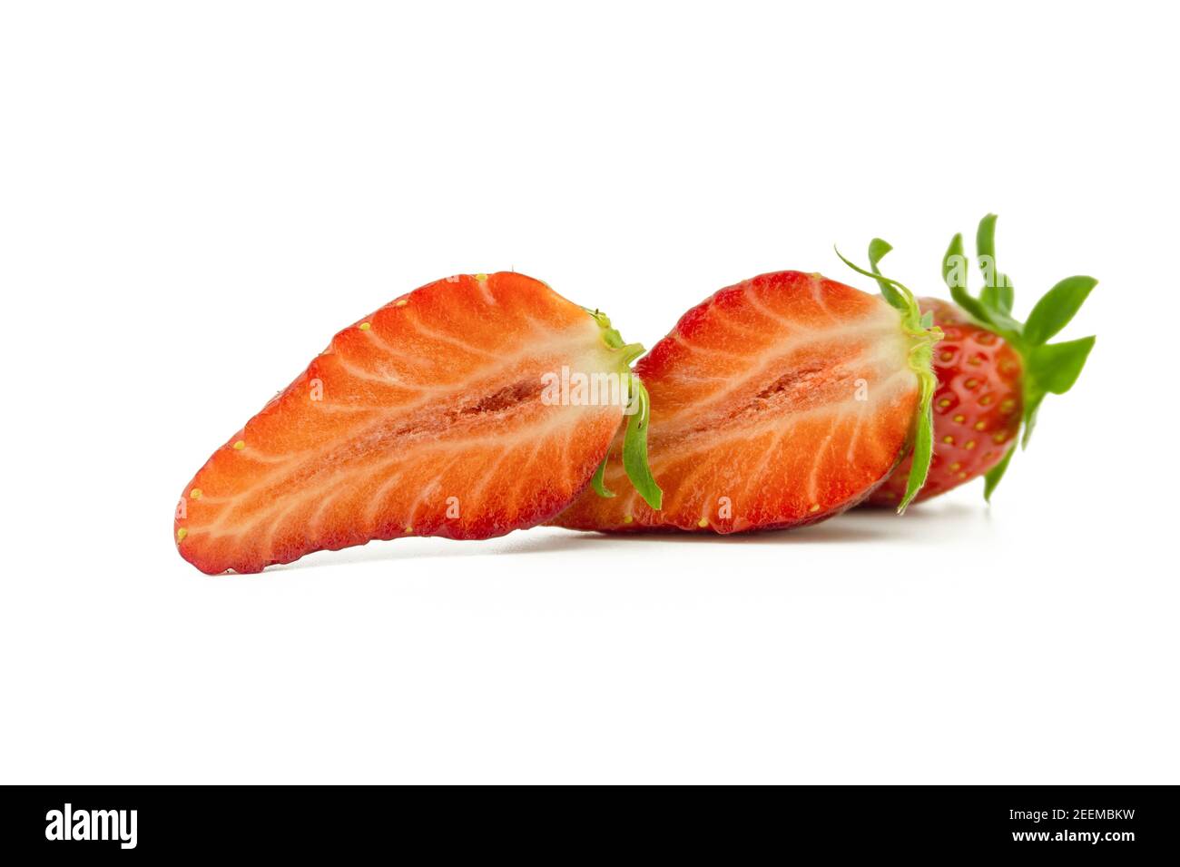 Ripe juicy strawberry fruit cut in half isolated on white background ...