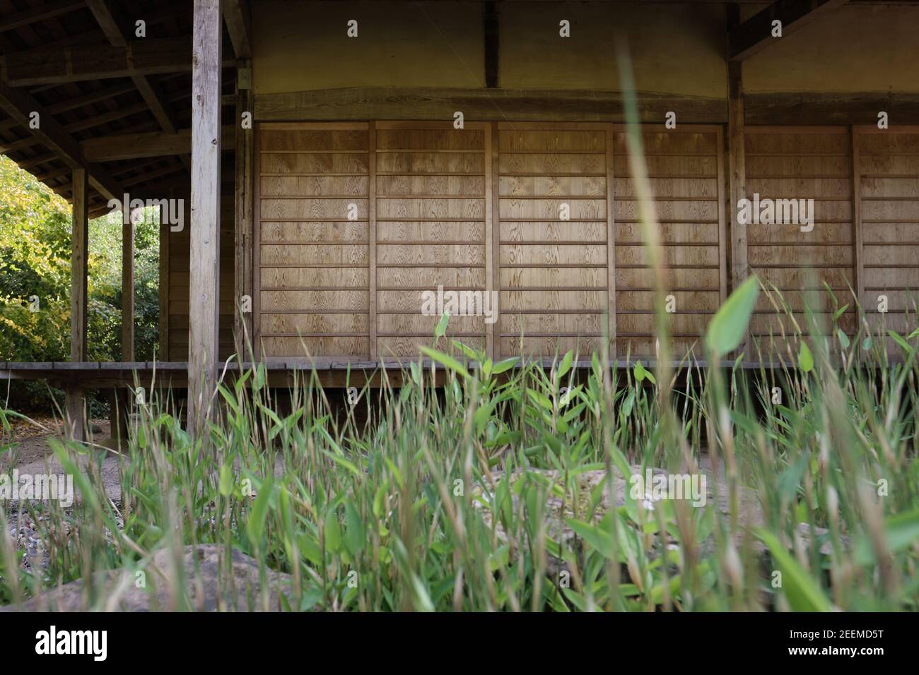 Old traditional Japanese wooden house with closed sliding rain shutters ...