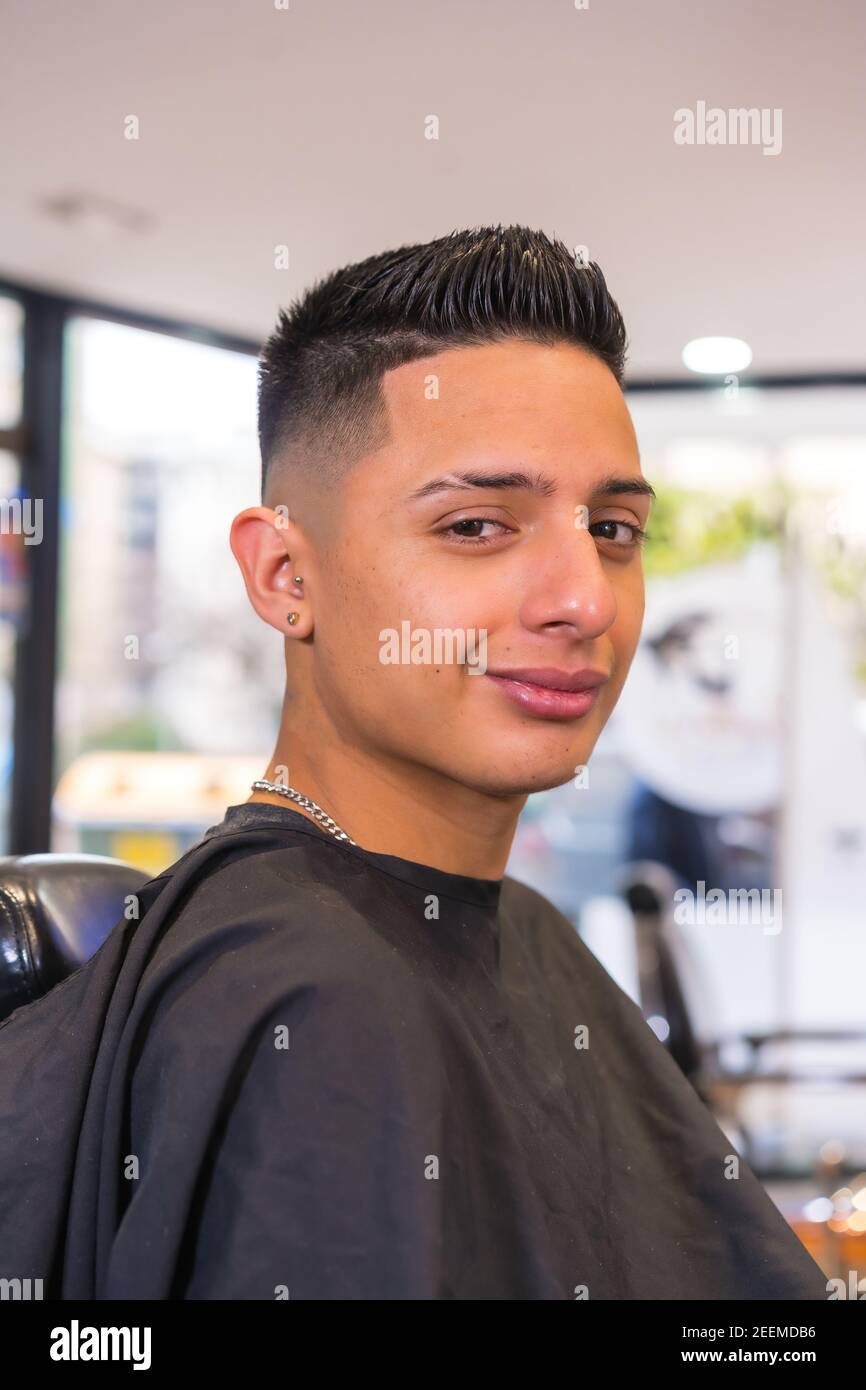 Vertical side view of a male with a fresh haircut Stock Photo - Alamy