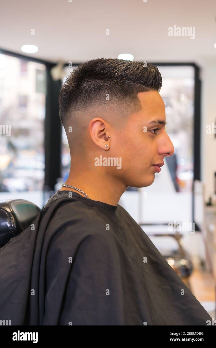 Vertical side view of a male with a fresh haircut Stock Photo - Alamy