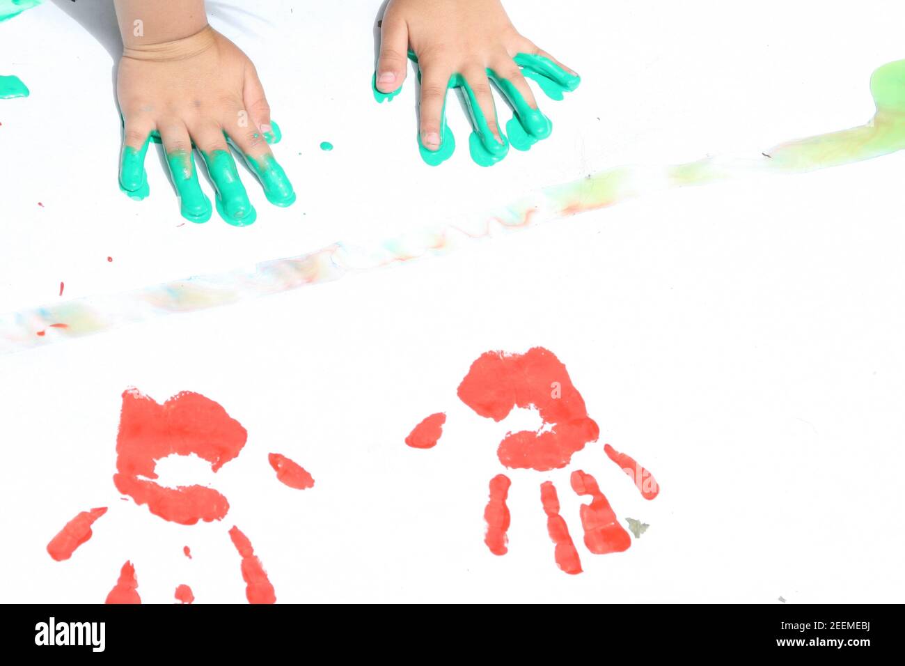 Closeup shot of hands doing hand art with paint Stock Photo - Alamy
