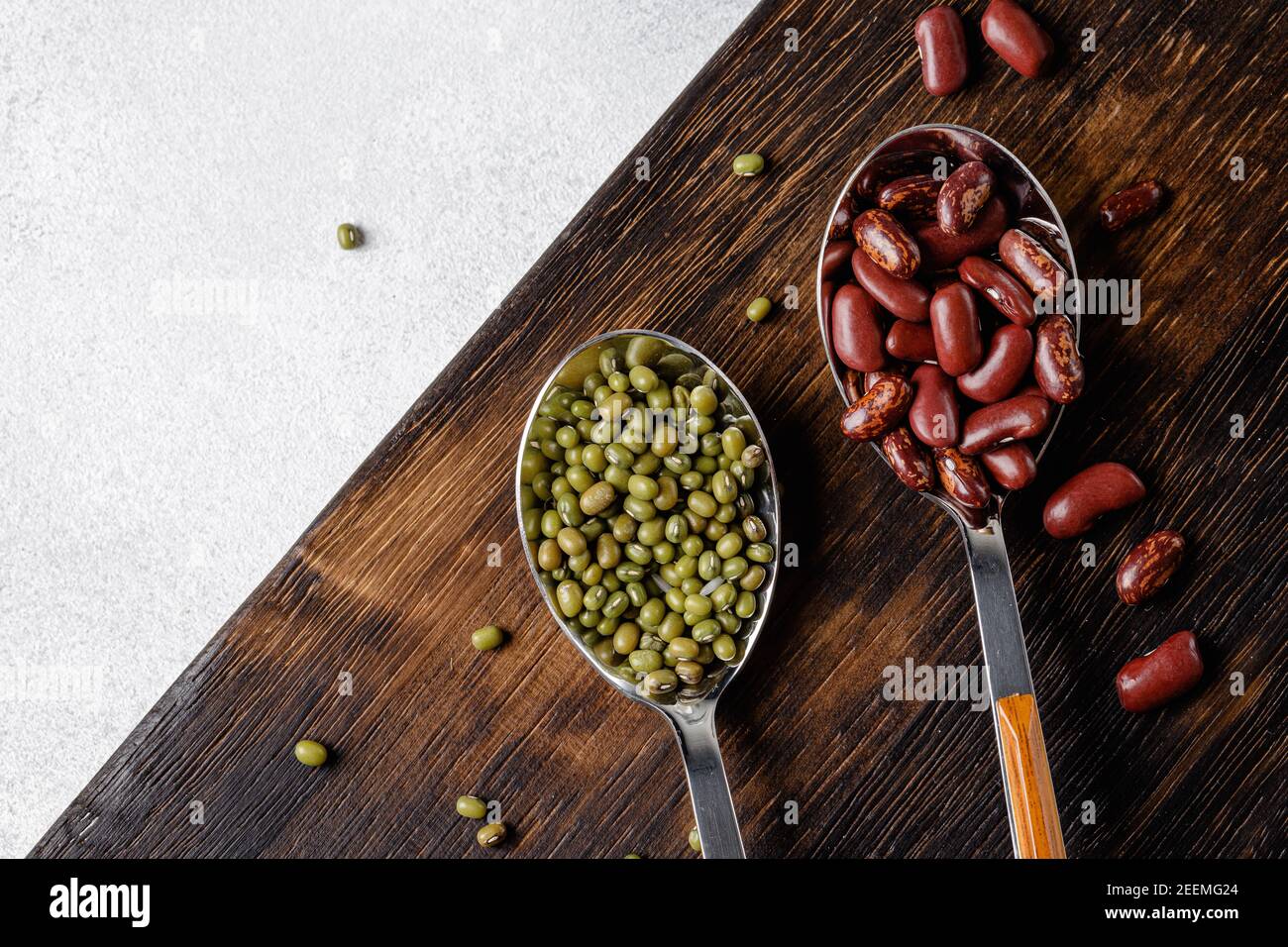 dried beans in wooden spoons on the table Stock Photo - Alamy