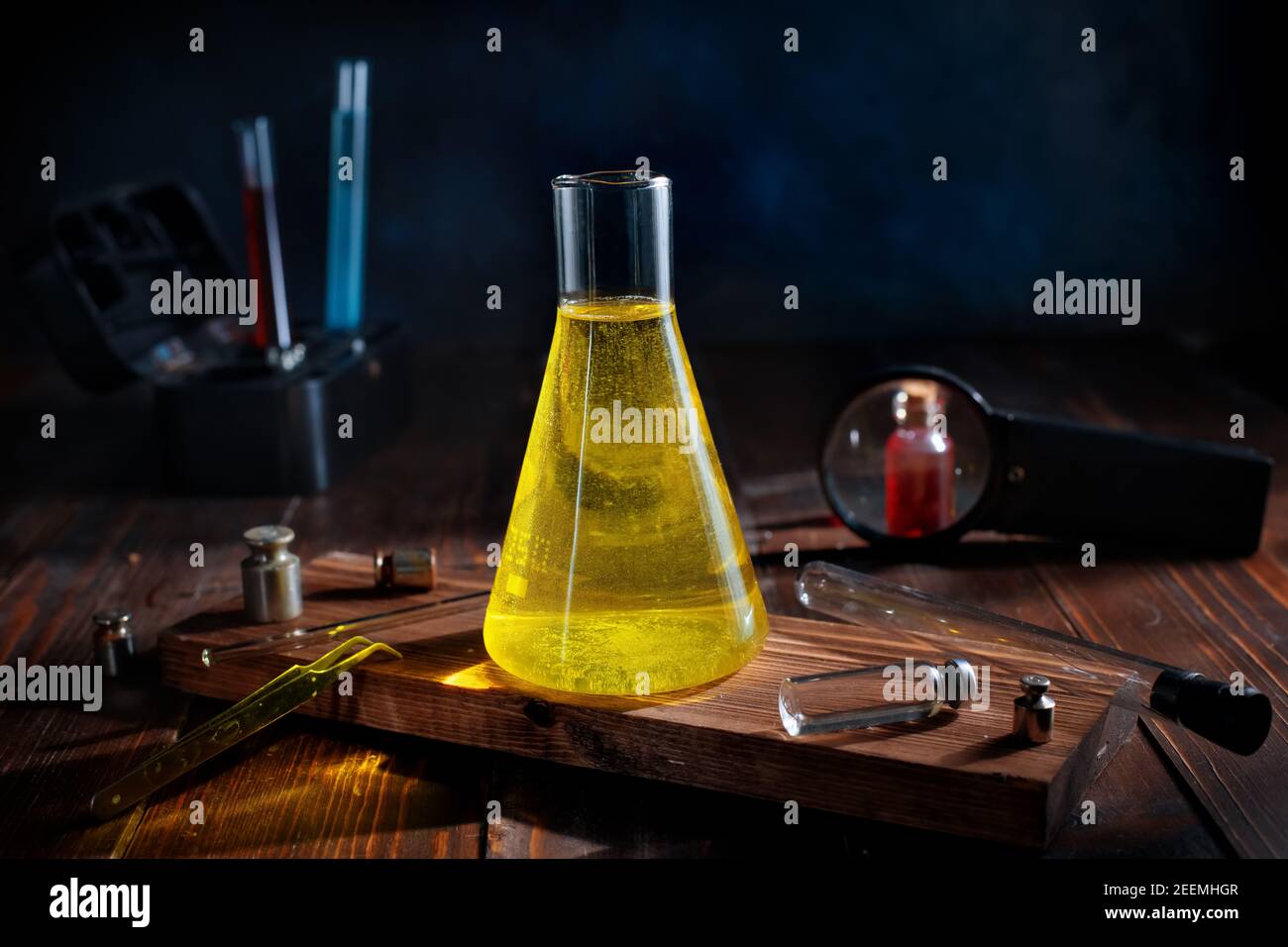 clear yellow liquid in a chemical flask. Science, chemistry ...