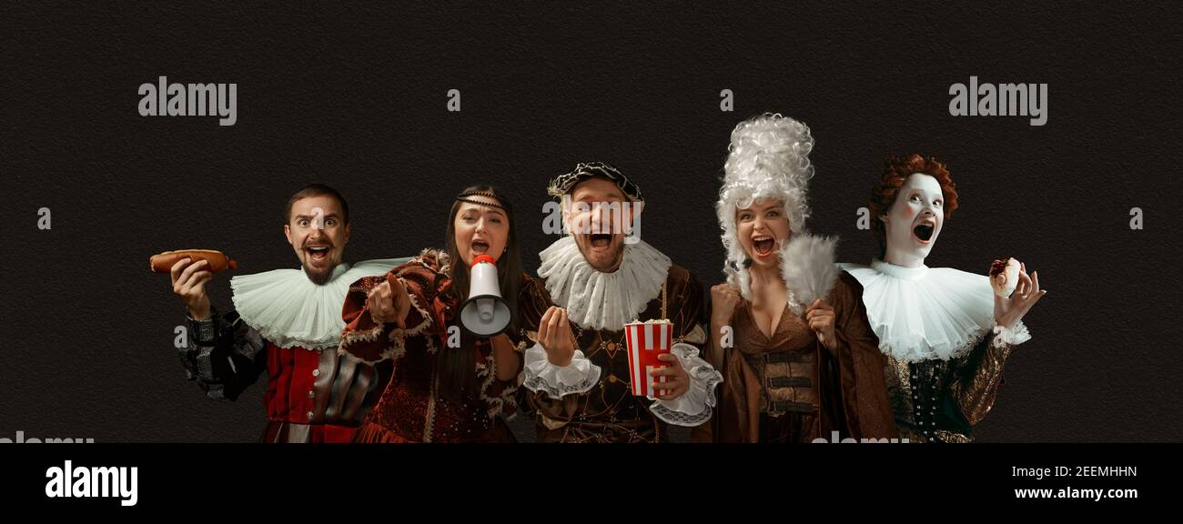 Cheering, screaming, eating. Medieval people as a royalty persons in ...