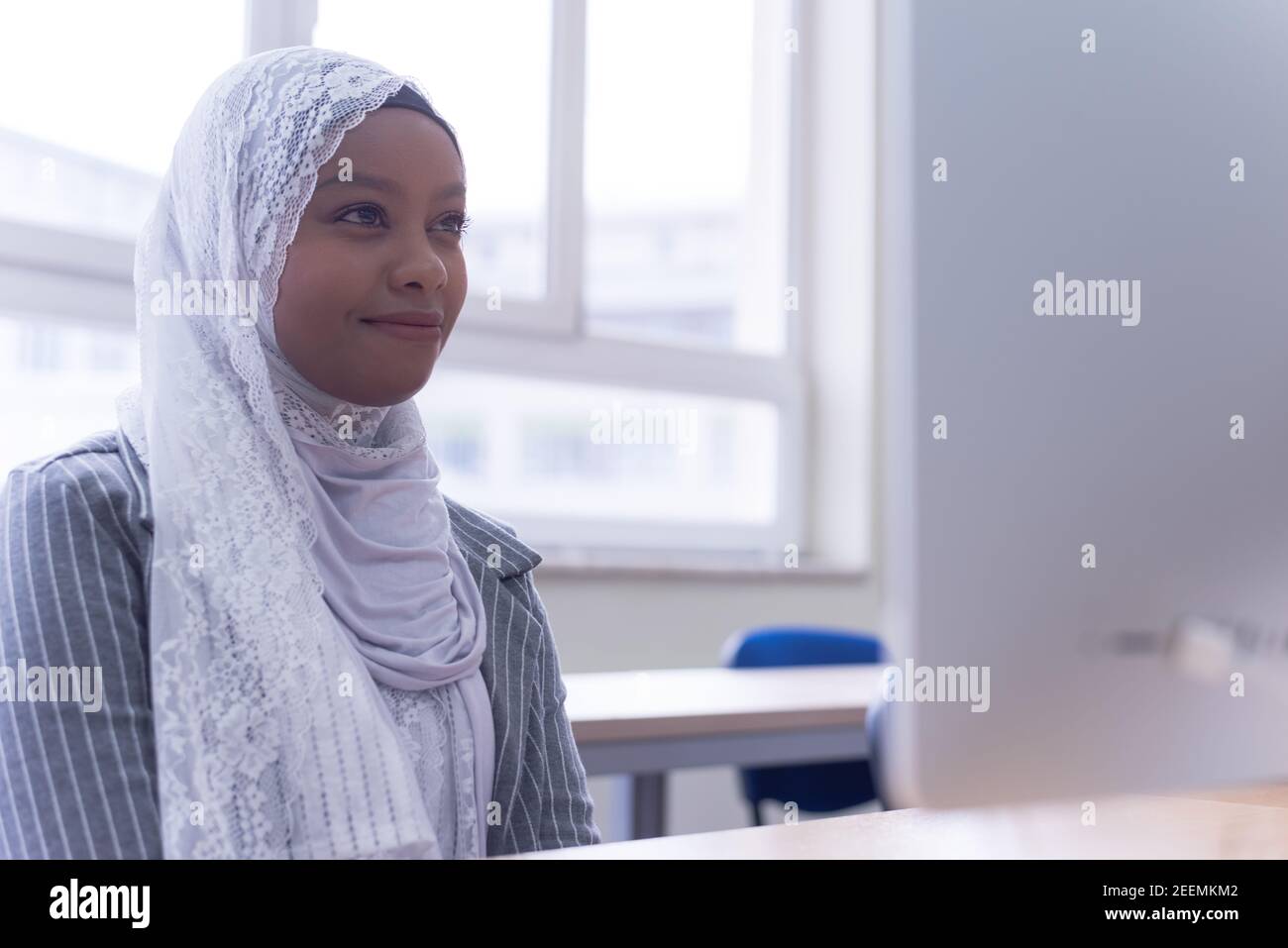 Beautiful female muslim african american IT student working at her ...