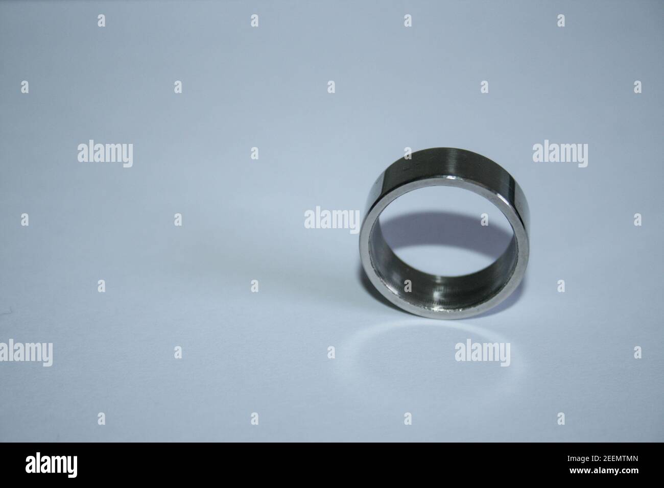 Ring isolated on light blue background Stock Photo - Alamy