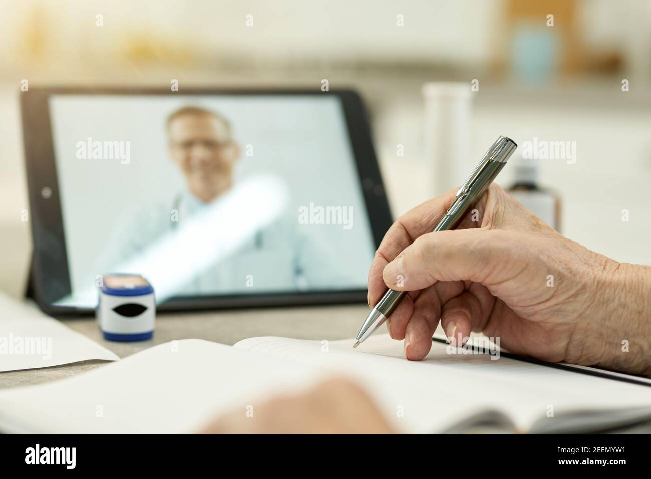 Selective focius photo of person with pen writing down notes while ...