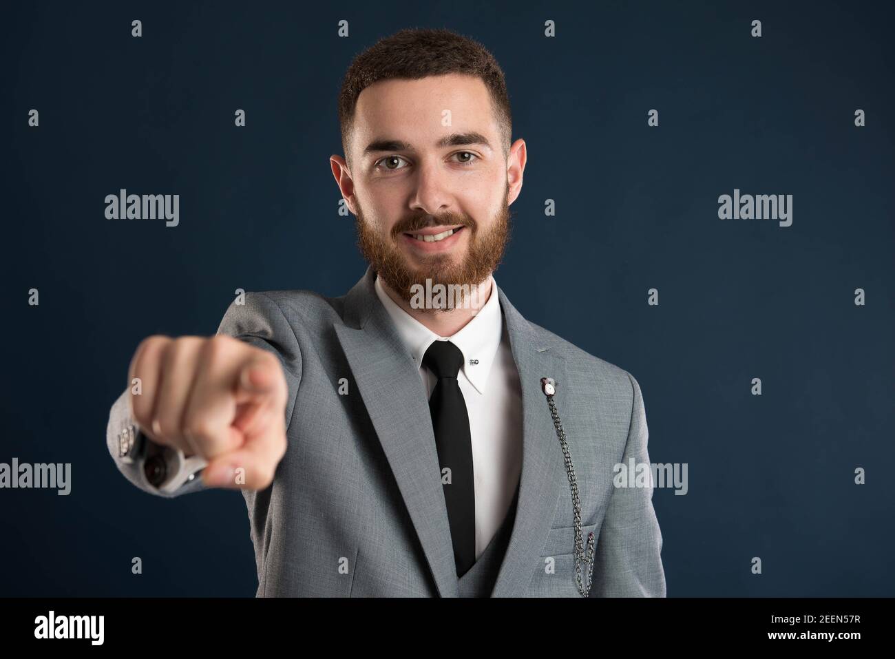 Smiling corporate guy pointing hi-res stock photography and images - Alamy