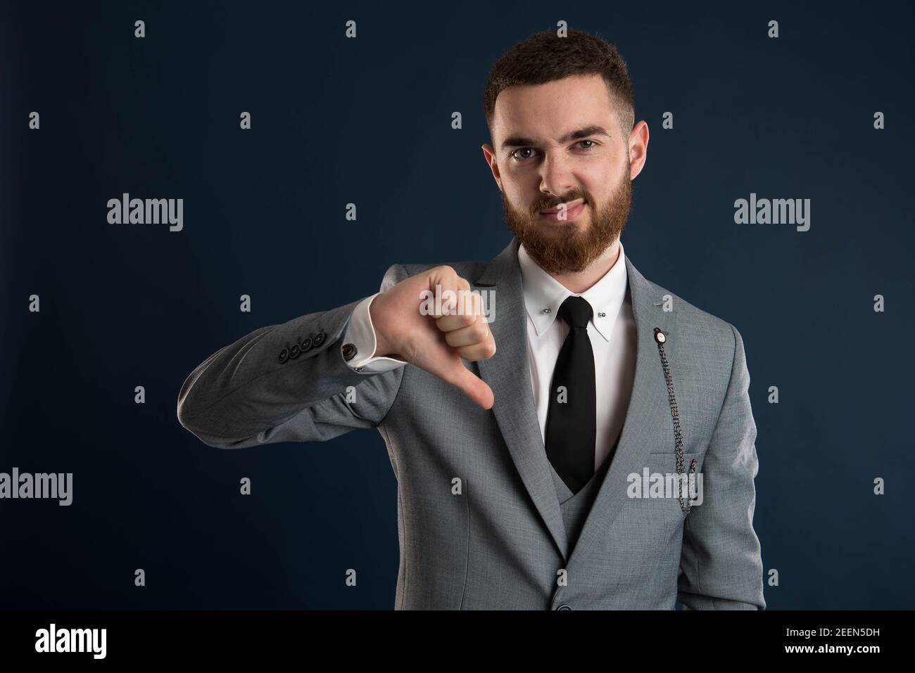 Upset businessman showing dislike sign wearing formal clothes Stock ...