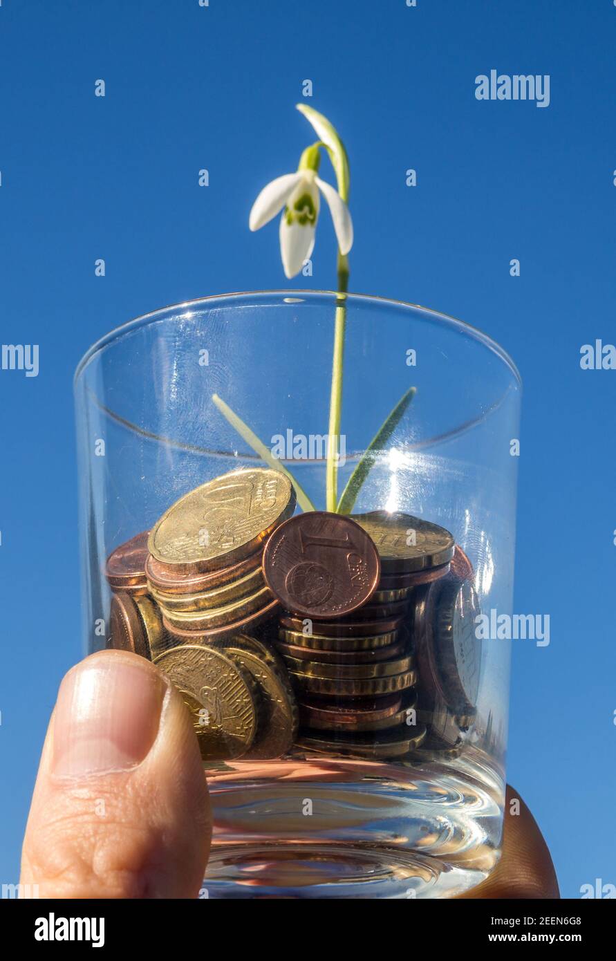 investment Symbols glass with coins Stock Photo - Alamy