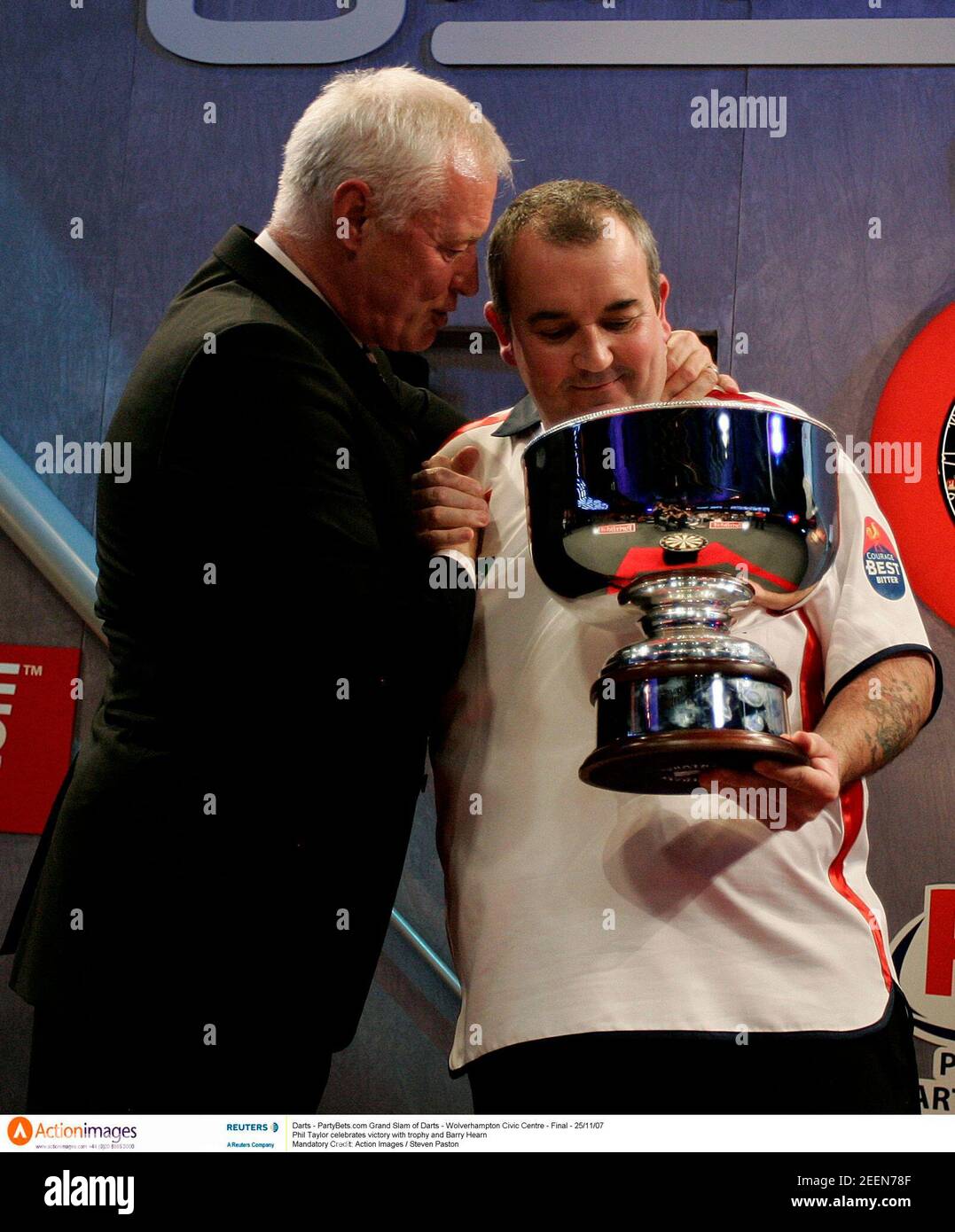 Phil taylor celebrates with the trophy hi-res stock photography and ...