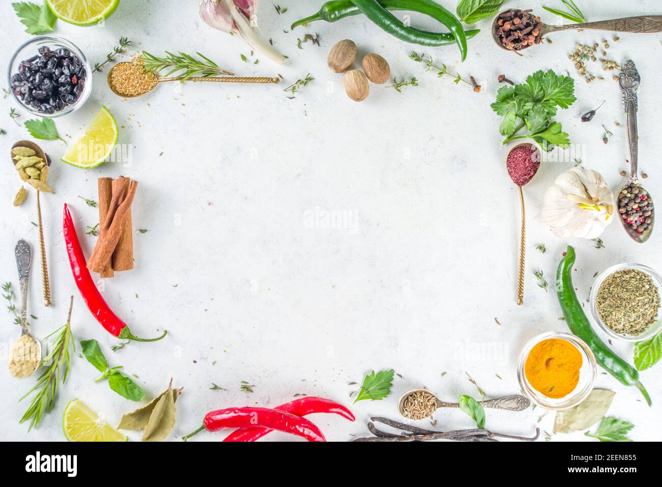 Fresh herbs, dried colorful spices. Cooking background flatlay with ...