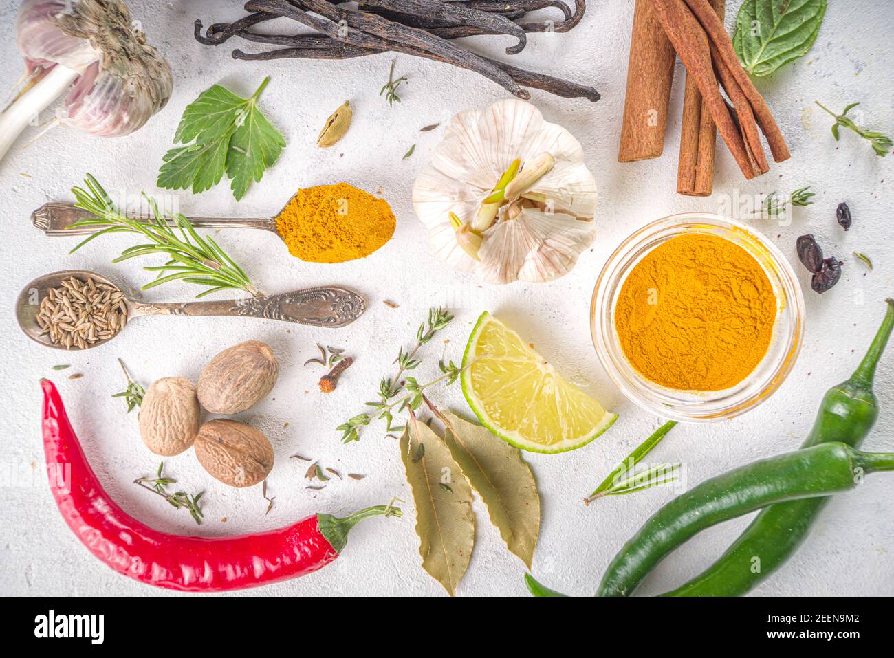 Fresh herbs, dried colorful spices. Cooking background flatlay with ...