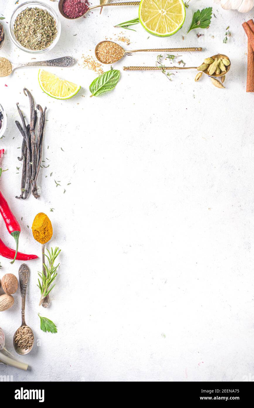 Fresh herbs, dried colorful spices. Cooking background flatlay with ...