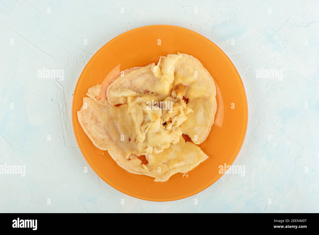 Missing pancake. The first pancake is always lumpy. Top view. Copy ...