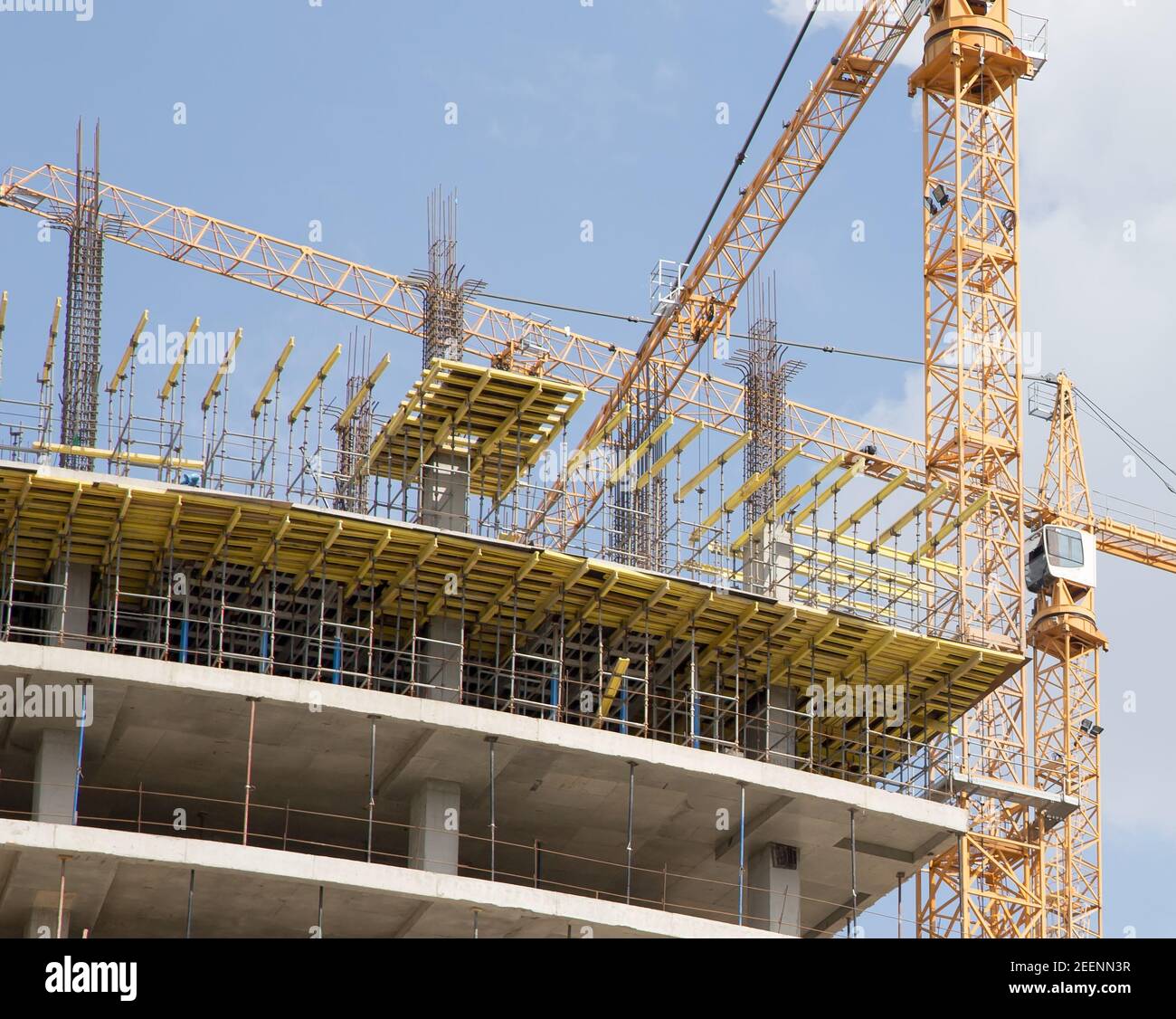 Cranes on a construction site. Industrial image Stock Photo - Alamy