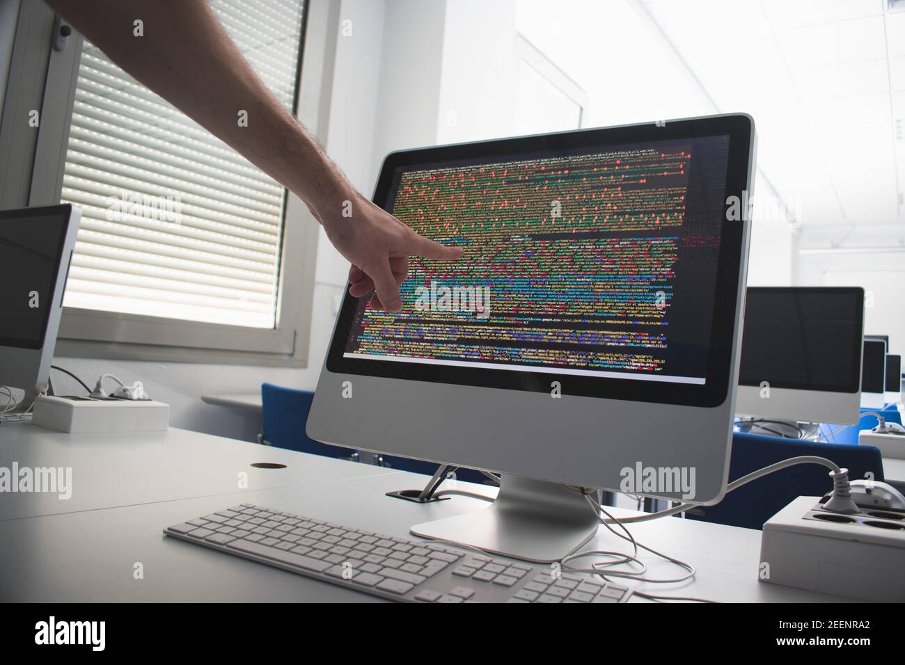 arm pointing at a computer screen Stock Photo - Alamy